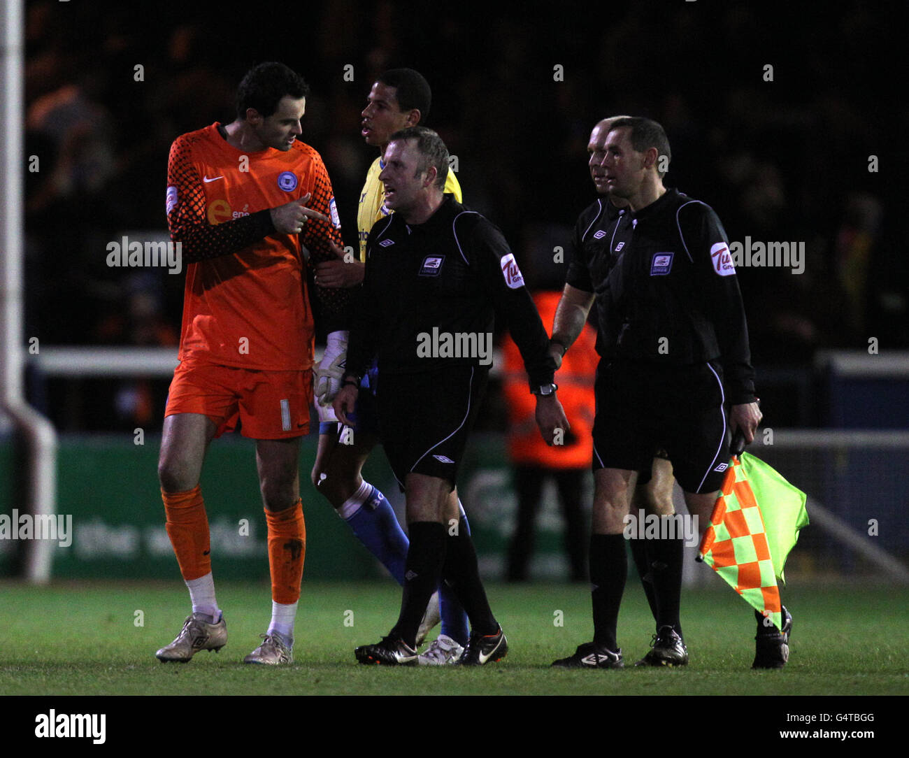 Peterborough United's goalkeeper Joe Lewis points the finger at referee ...