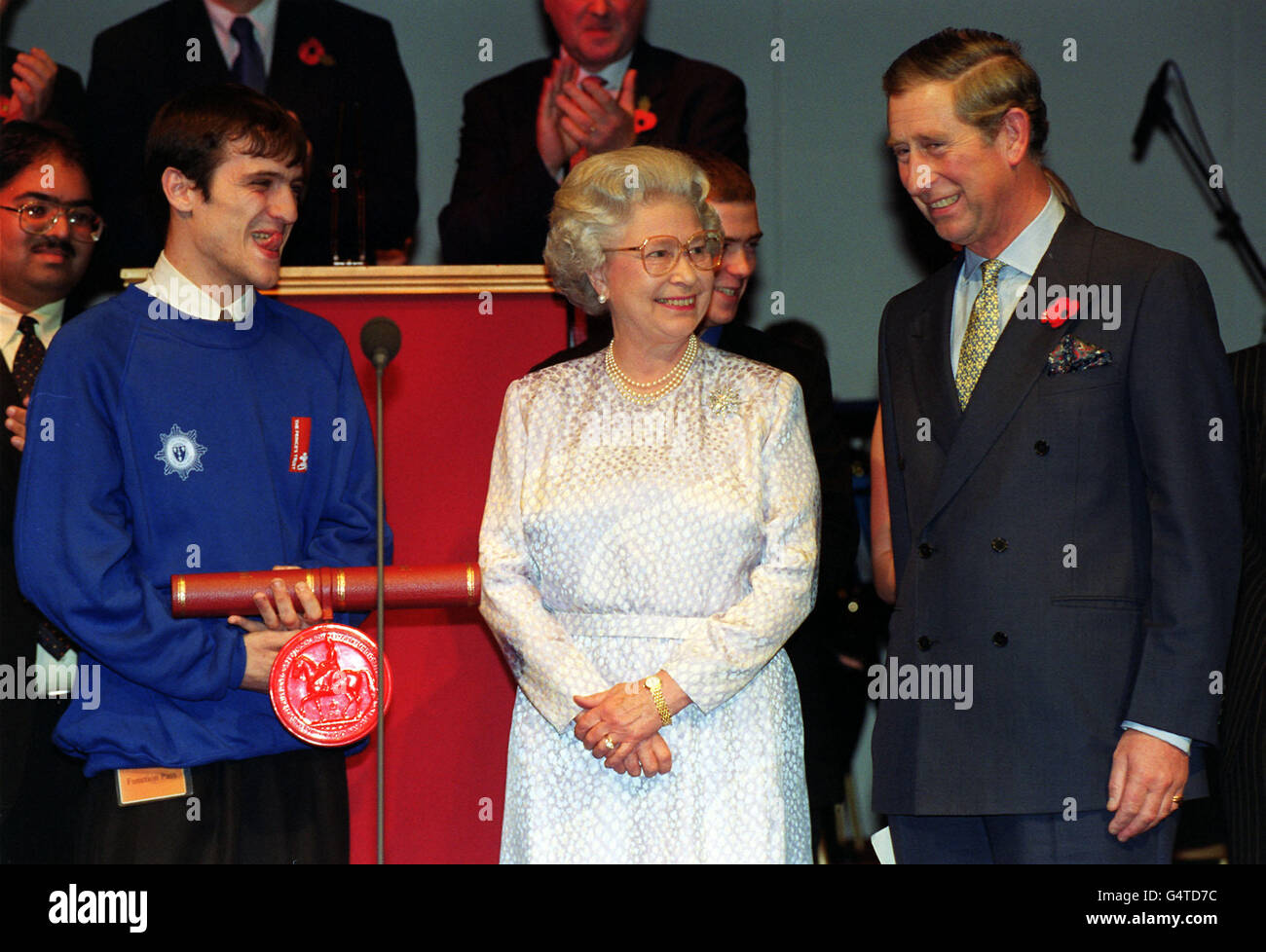 The Queen (centre) with Alan Scoullar, a 23-year-old from Runcorn who ...