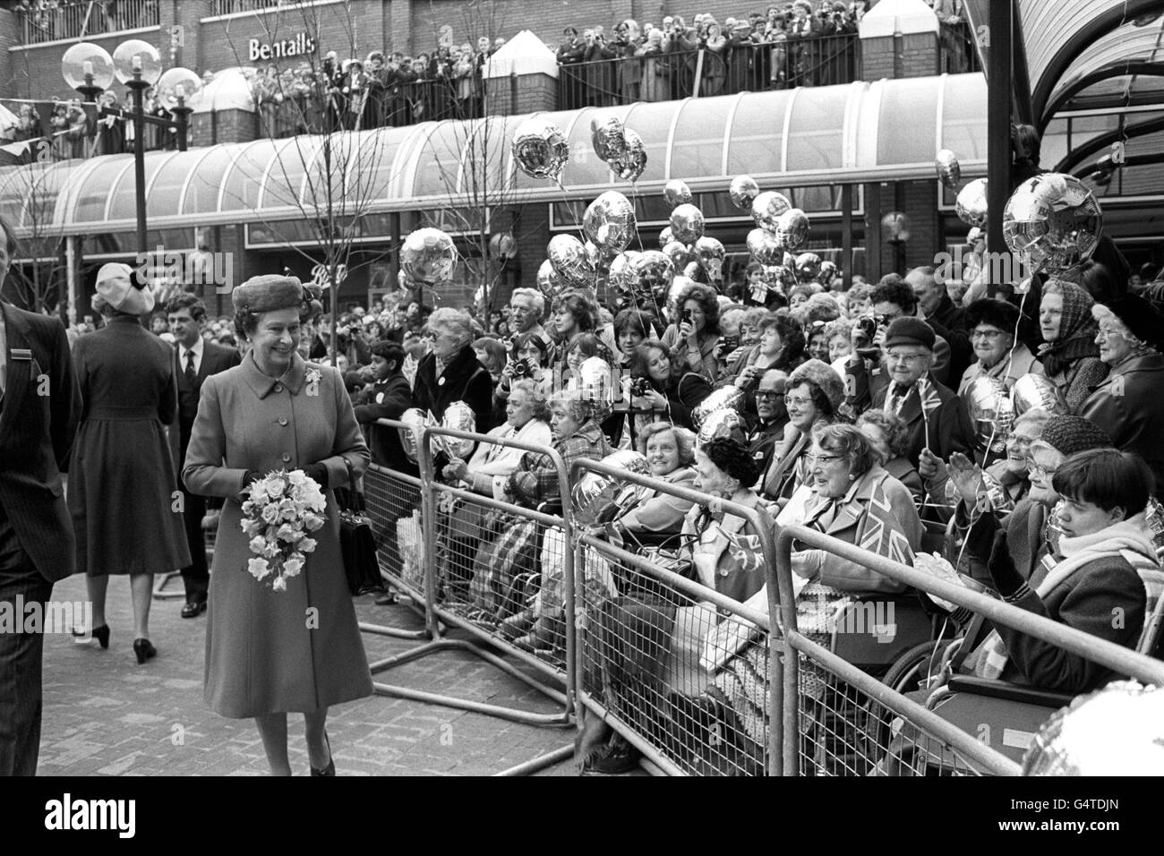 Queen Elizabeth II opening the Ealing Broadway Centre. Behind her ...