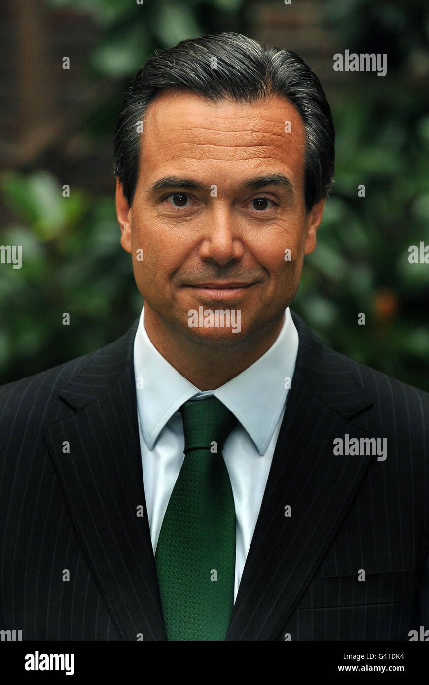 Exhausted bank boss returns to work Stock Photo - Alamy