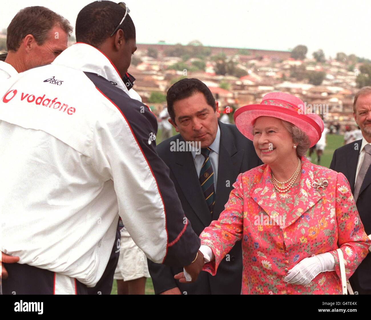 The Queen with South African Cricket boss Ali Bacher (C) shakes hands ...