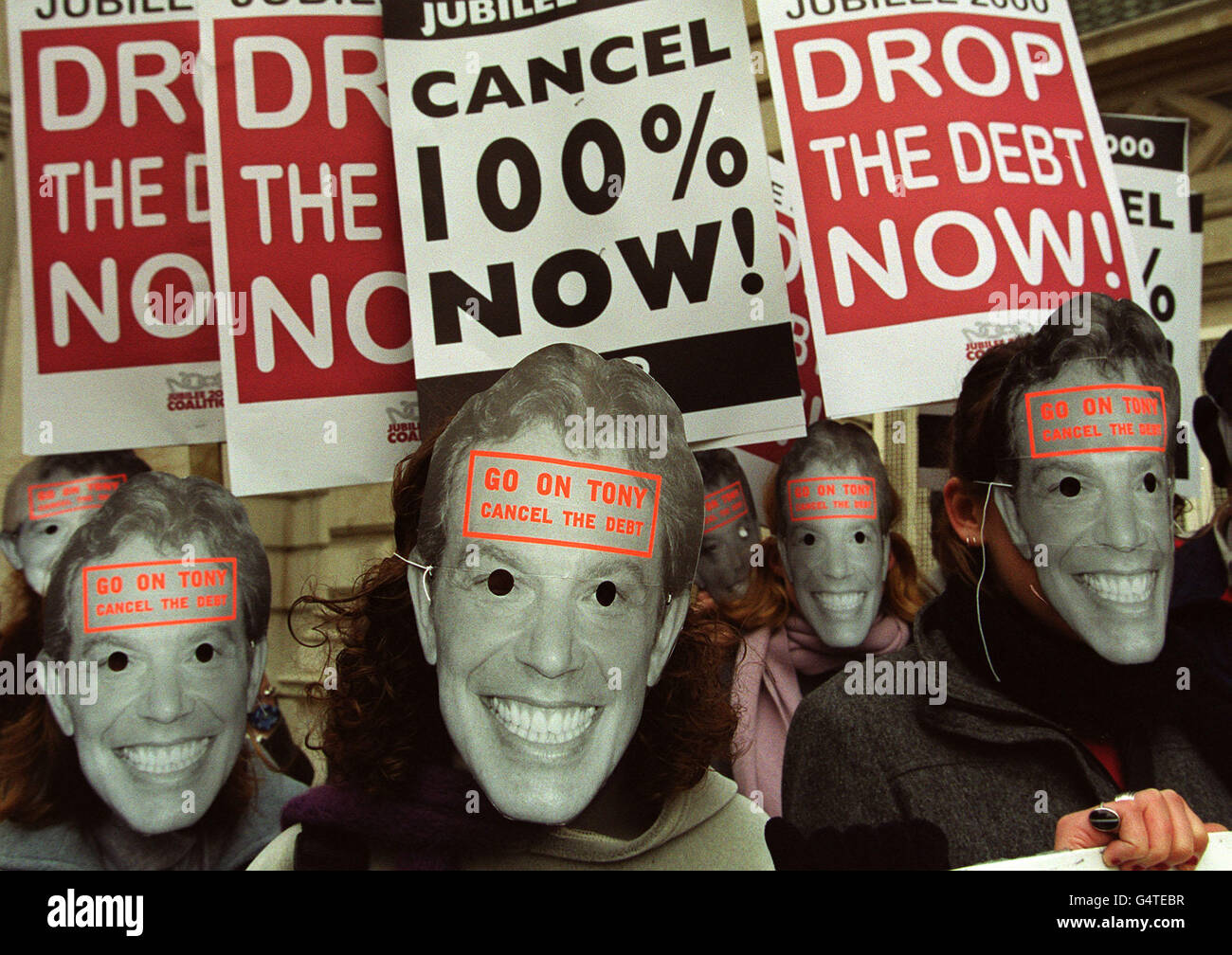 Supporters of the Jubilee 2000 coalition wearing Tony Blair masks ...
