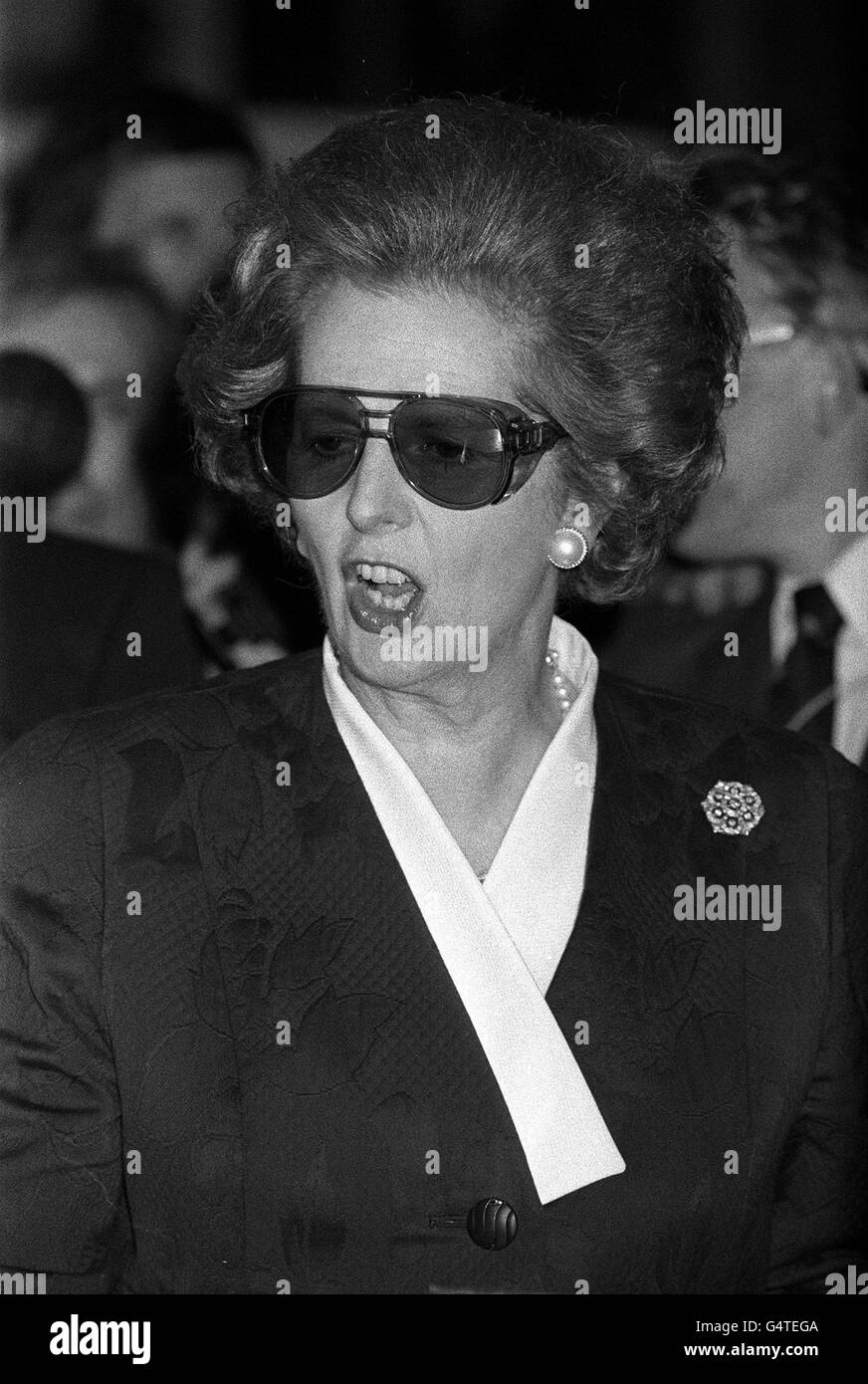 Prime Minister Margaret Thatcher appears to be singing the praises of ...