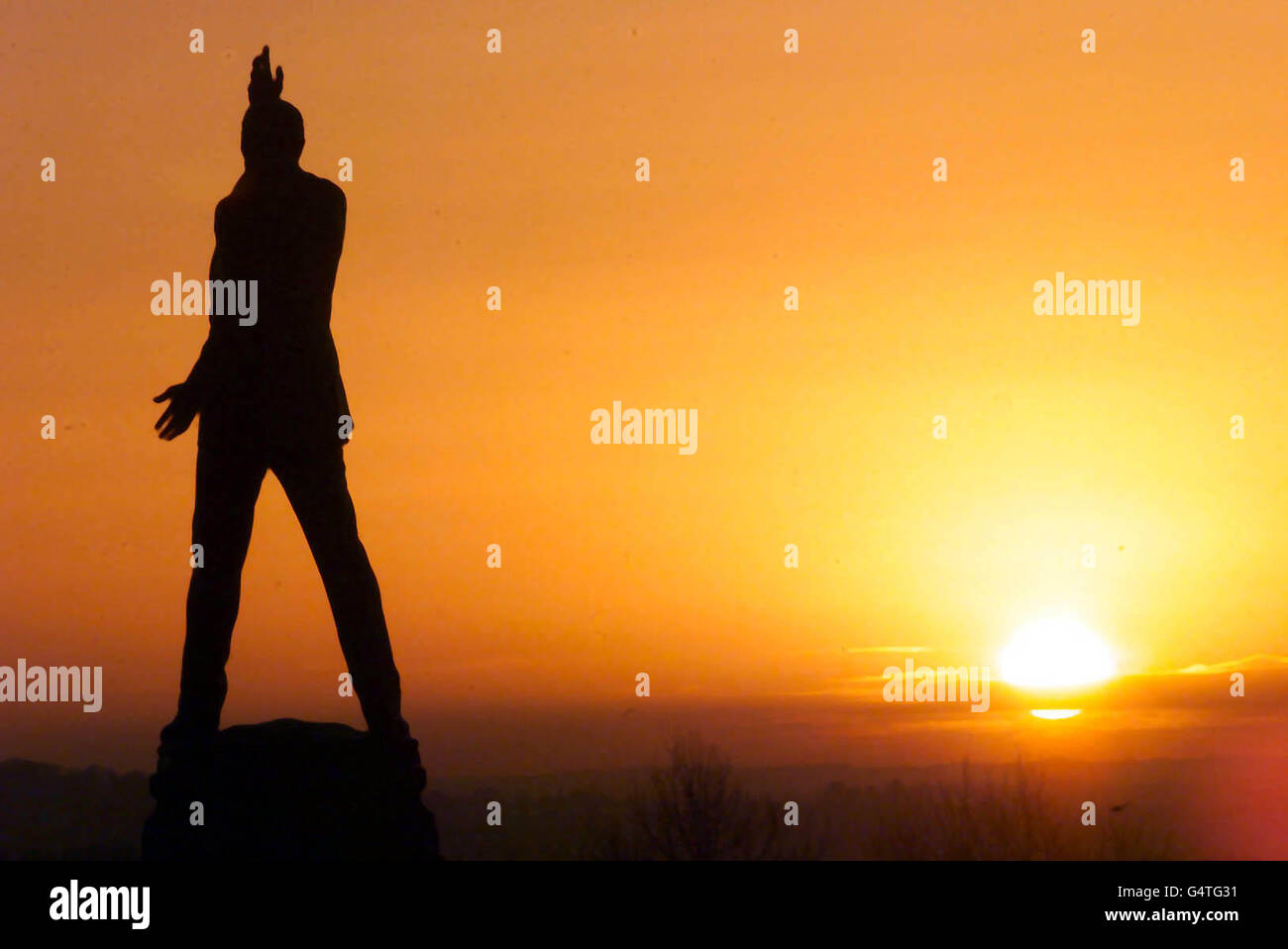 The Statue of Lord Carson, the former Unionist leader, is silhouetted ...