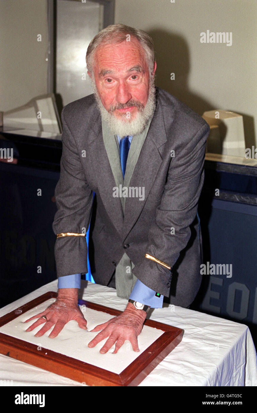 Actor Sir Nigel Hawthorne making his handprints for the cinema's Hall ...