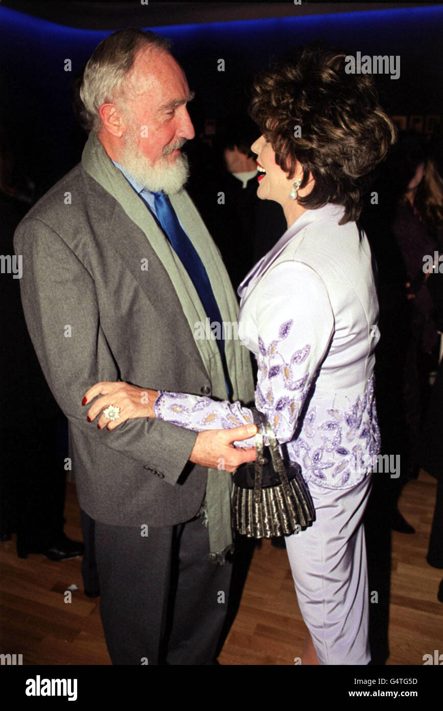 Actors Sir Nigel Hawthorne and Joan Collins arrive at the charity world ...