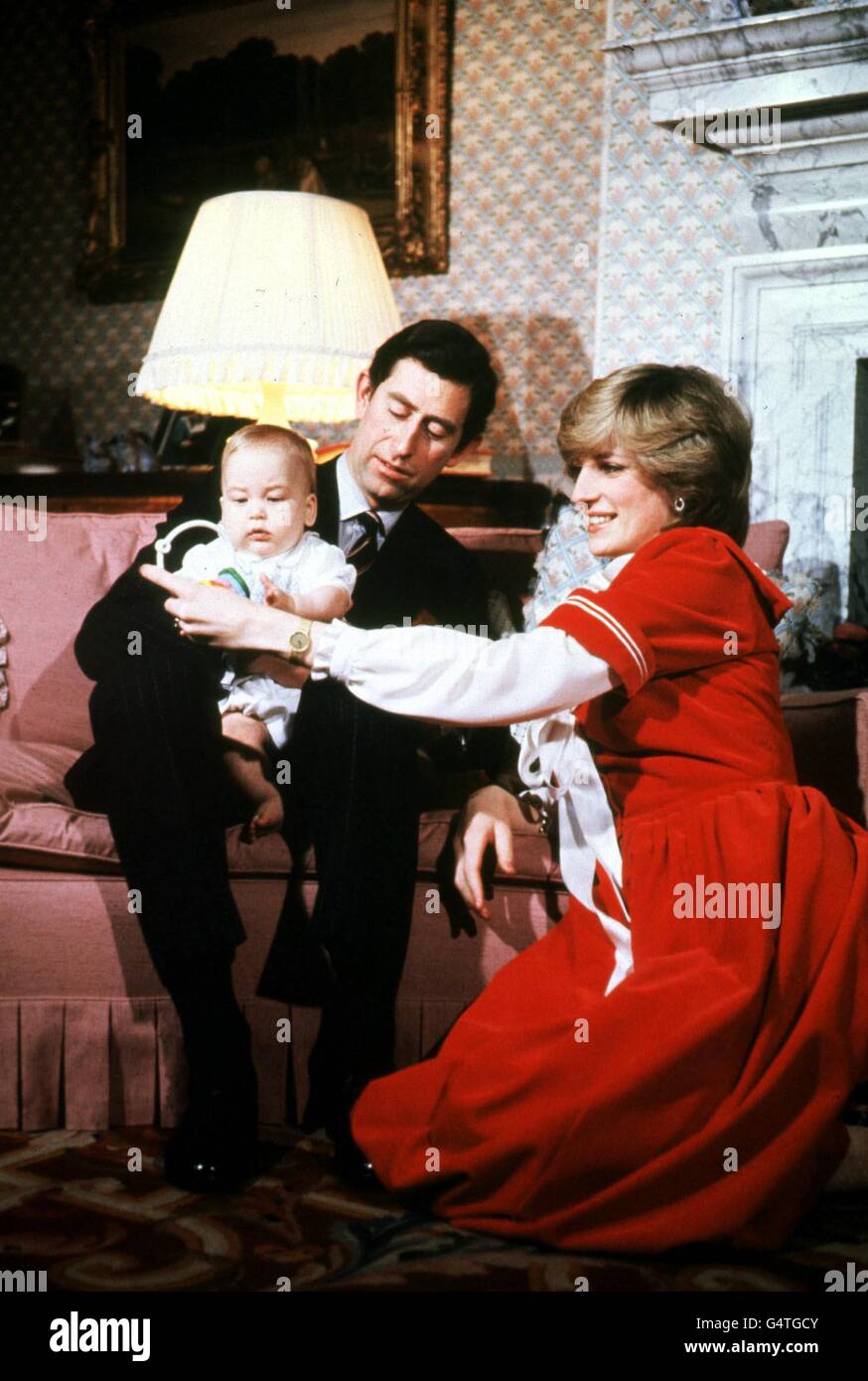 Baby Prince William sits in the lap of his father, the Prince of Wales ...