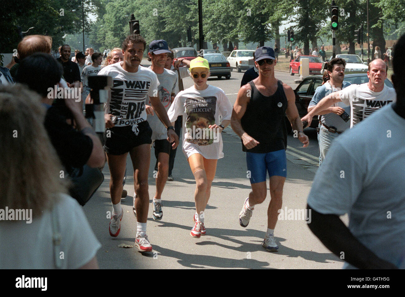 Madonna with bodyguards jogging through hyde park hi-res stock ...