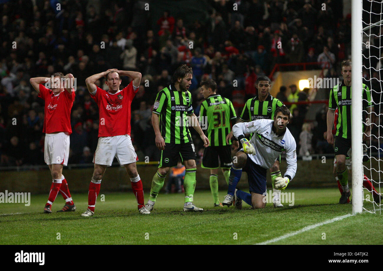 Wrexham's Andy Morrell (second left) holds his head as his side miss a ...