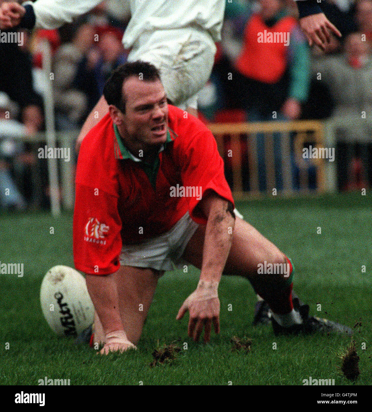 Wales captain Ieuan Evans scores a try against England, during their ...