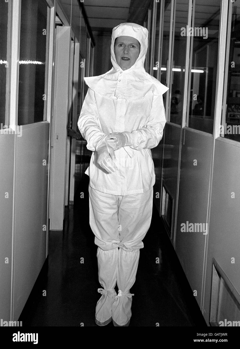 Prime Minister Margaret Thatcher wears protective clothing as she tours ...