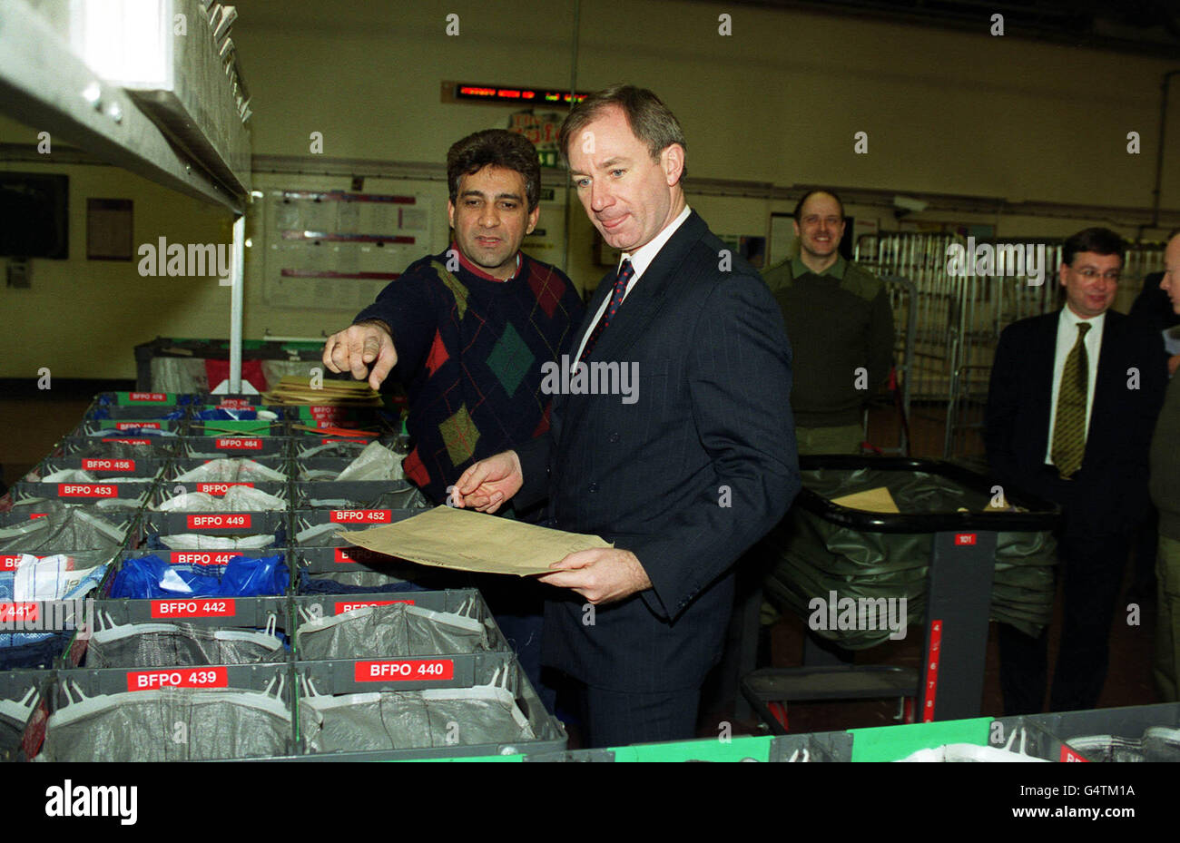 Defence Secretary Geoff Hoon, helps sort the mail at the British Forces ...