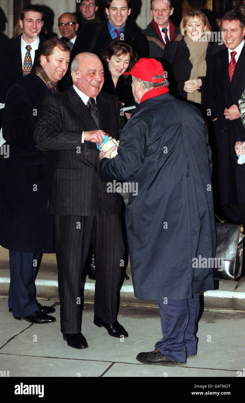 Harrods chief Mohamed Al Fayed is offered a sweet by a wellwisher ...