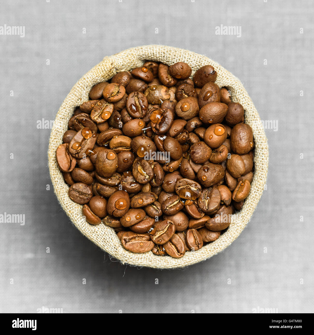 coffee beans in a flax sack on grey background Stock Photo - Alamy