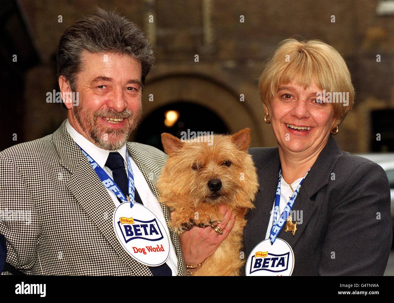 Bill and Trisha Gray from Leicester hug their Norwich terrier dog Sygar ...