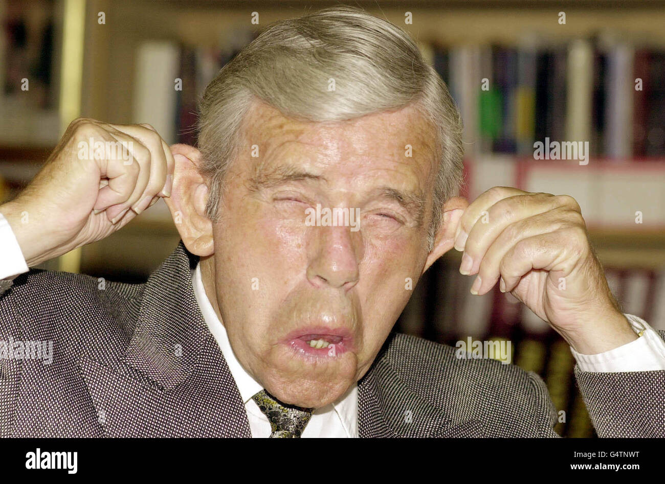 Sir Norman Wisdom, 84, pulls a face at a photocall at Stanley Gibbons ...