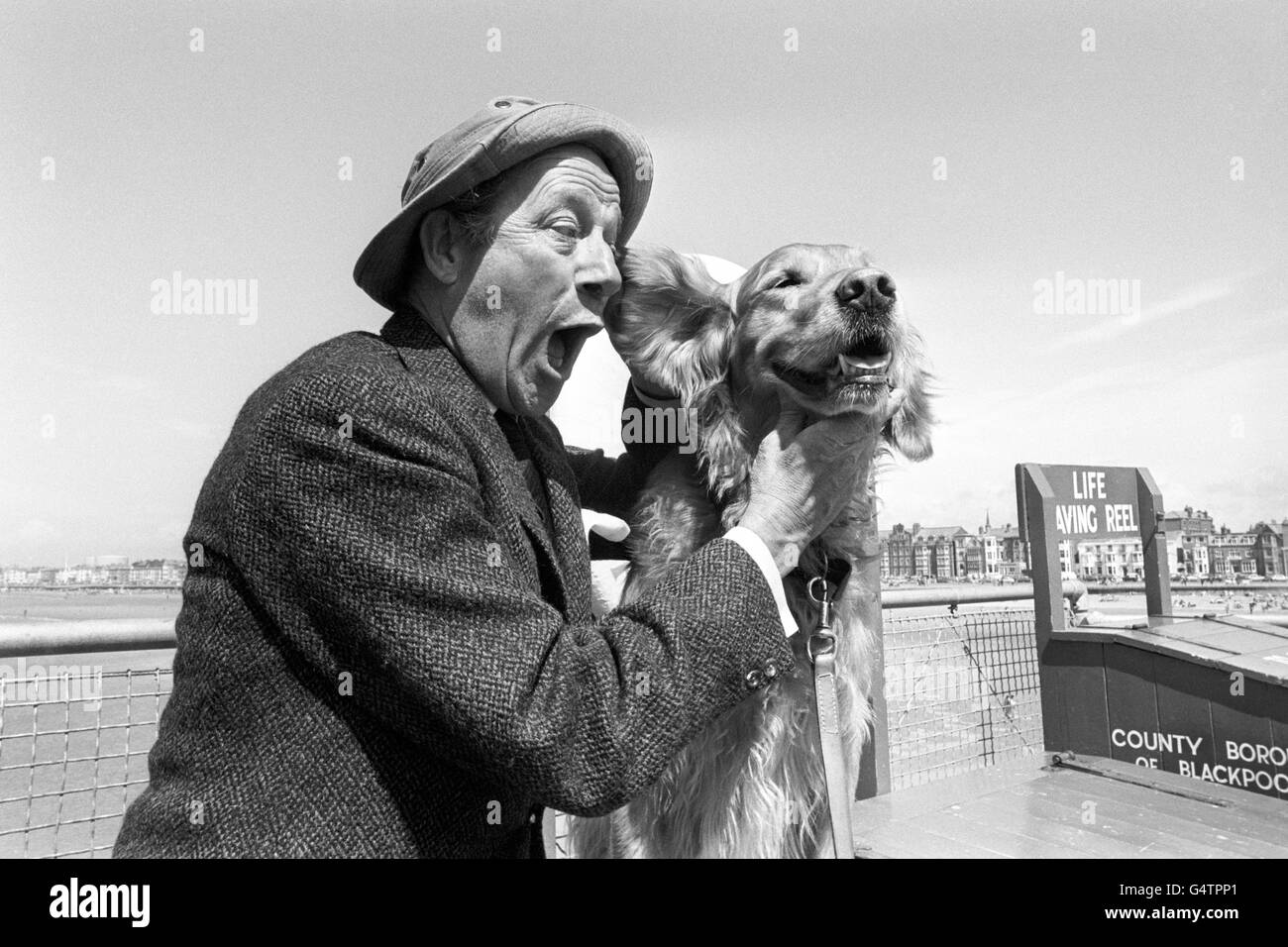 Actor Jimmy Jewel with his pet golden retriever Rusty on the South Pier ...