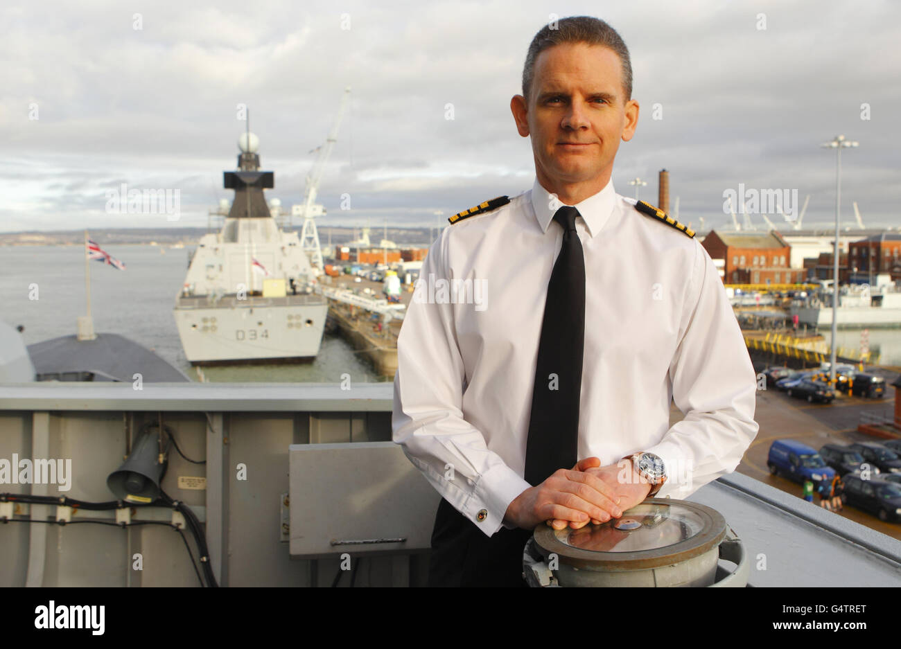 The Commanding Officer, Captain Guy Robinson, aboard HMS Daring in ...