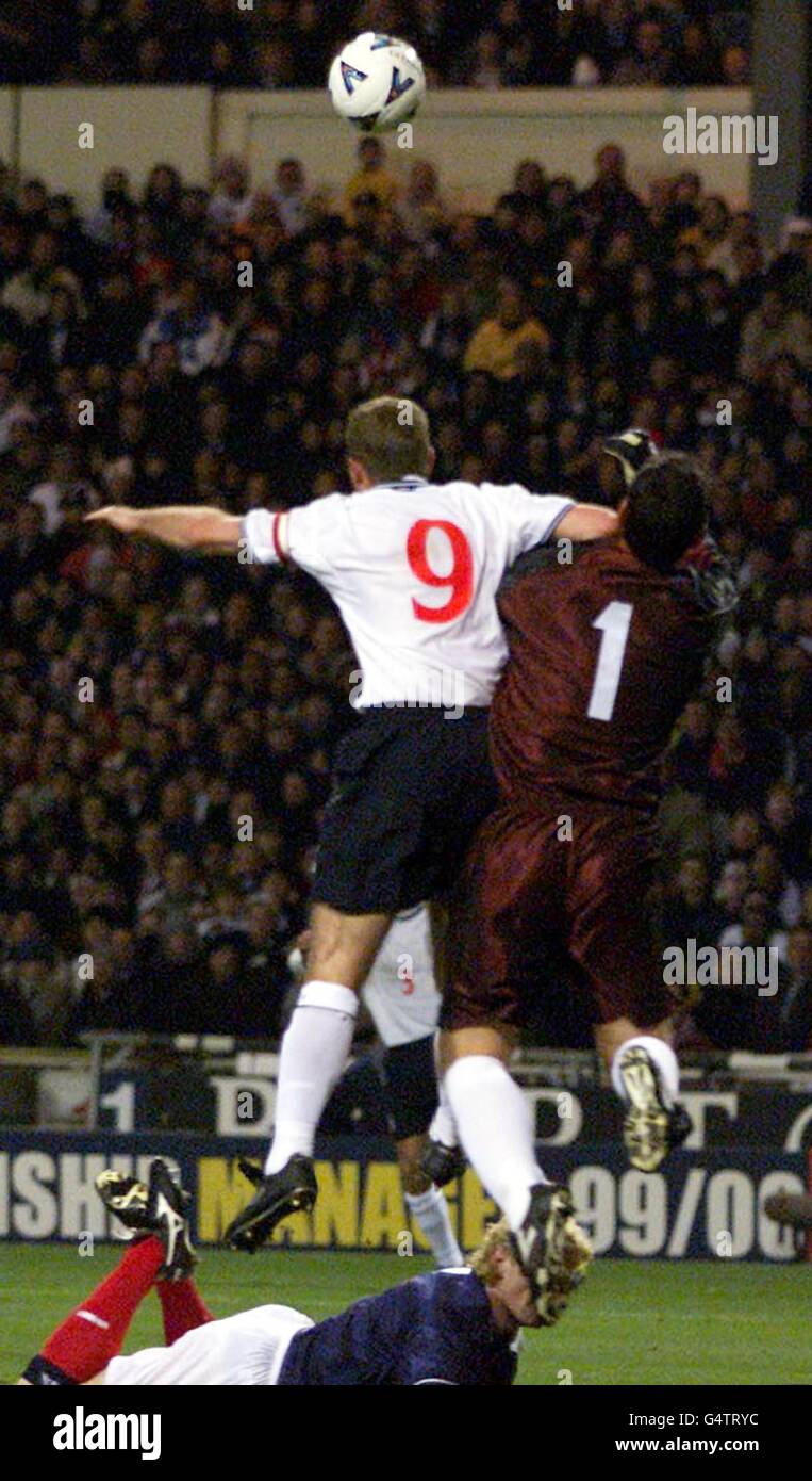 England's Alan Shearer (No 9) jumps with Scotland's goalkeeper Neil ...