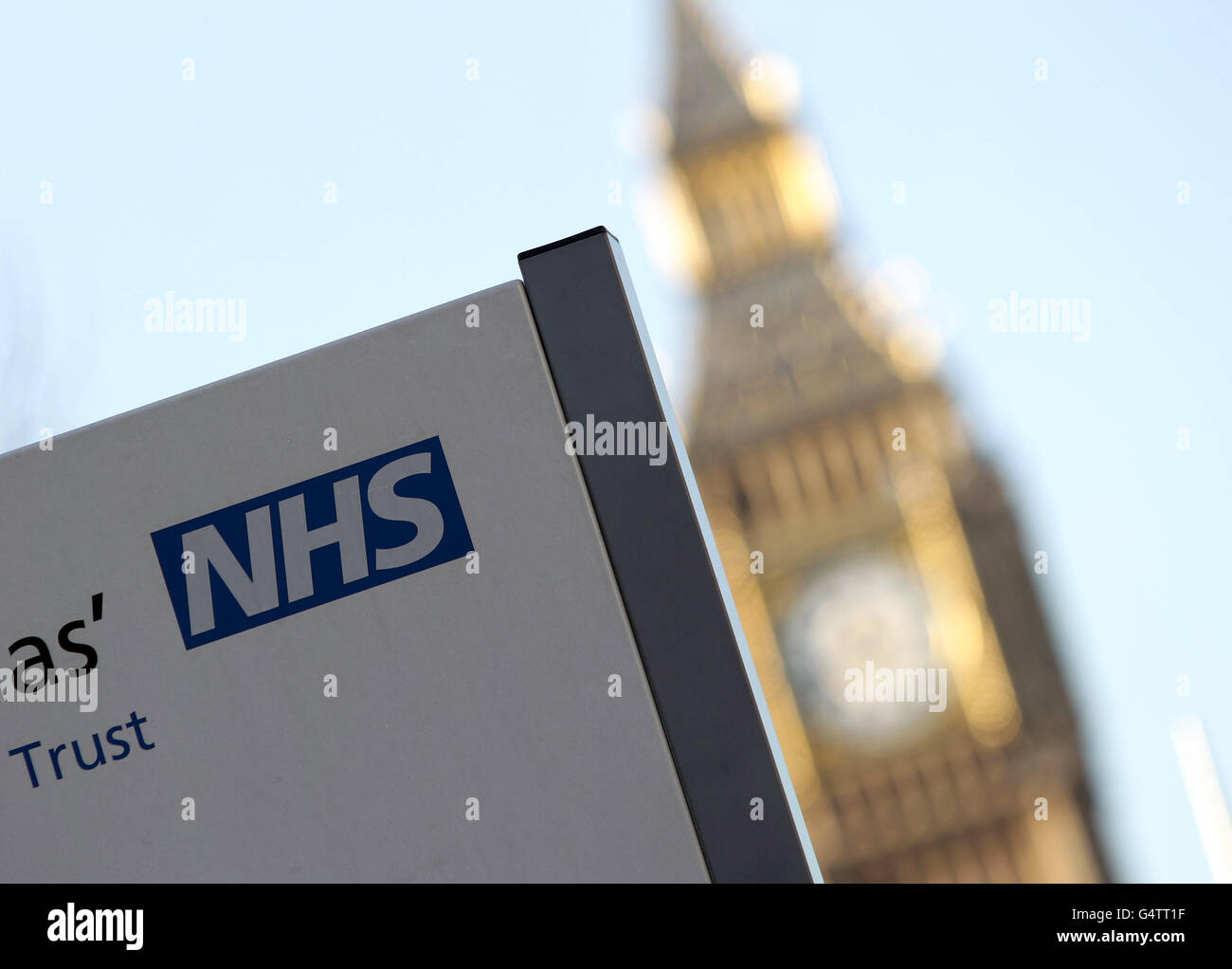 An NHS sign at St Thomas' Hospital, with Big Ben in the background, in ...