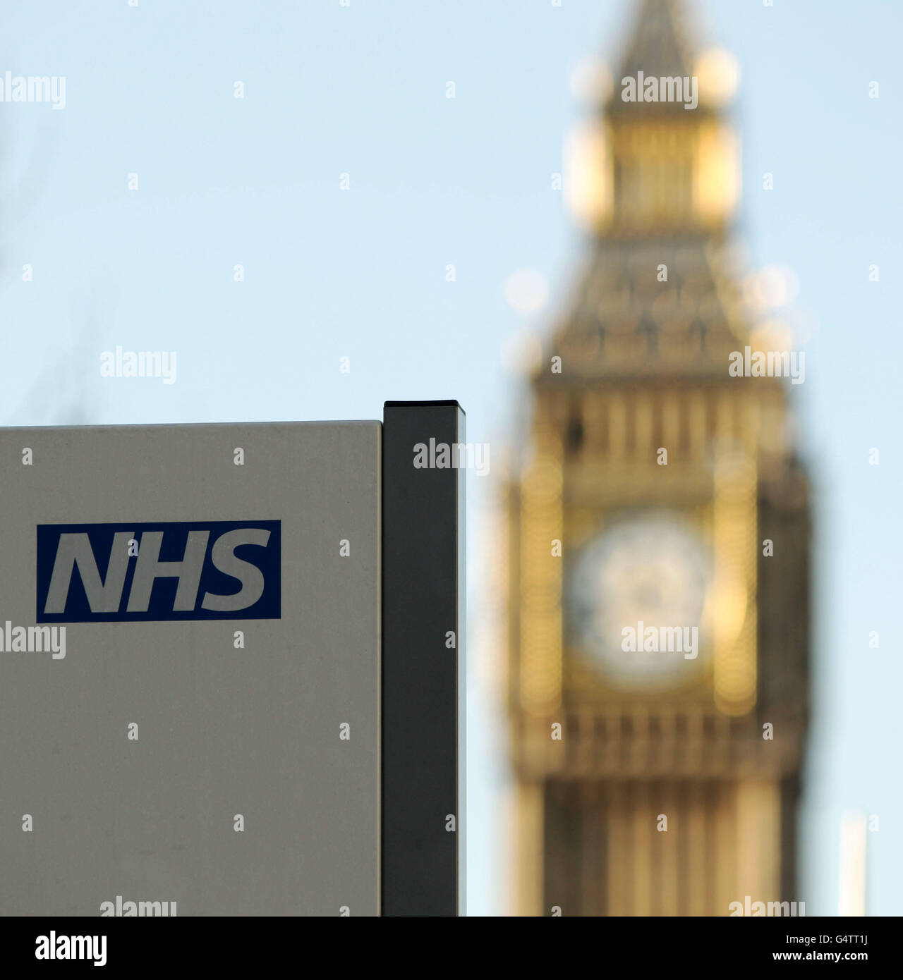 An NHS sign at St Thomas' Hospital, with Big Ben in the background, in ...