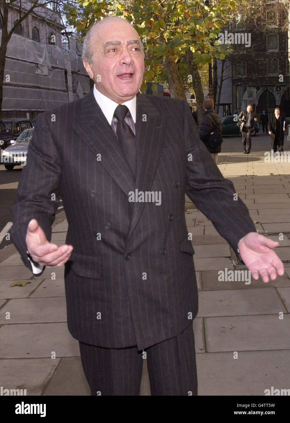 Harrods owner Mohammed Al Fayed gestures as he arrives at the High ...