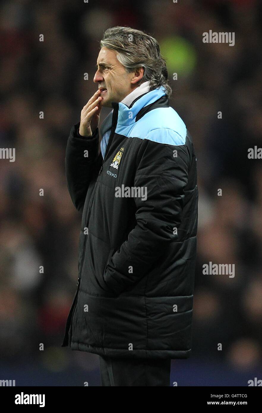 Manchester city manager roberto mancini looks thoughtful on the ...