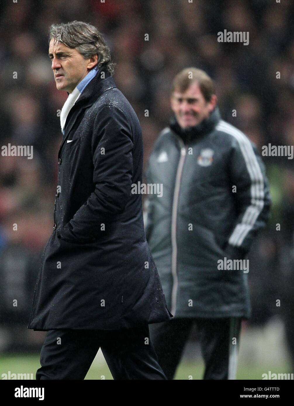 Liverpool manager Kenny Dalglish (right) and Manchestr City manager ...