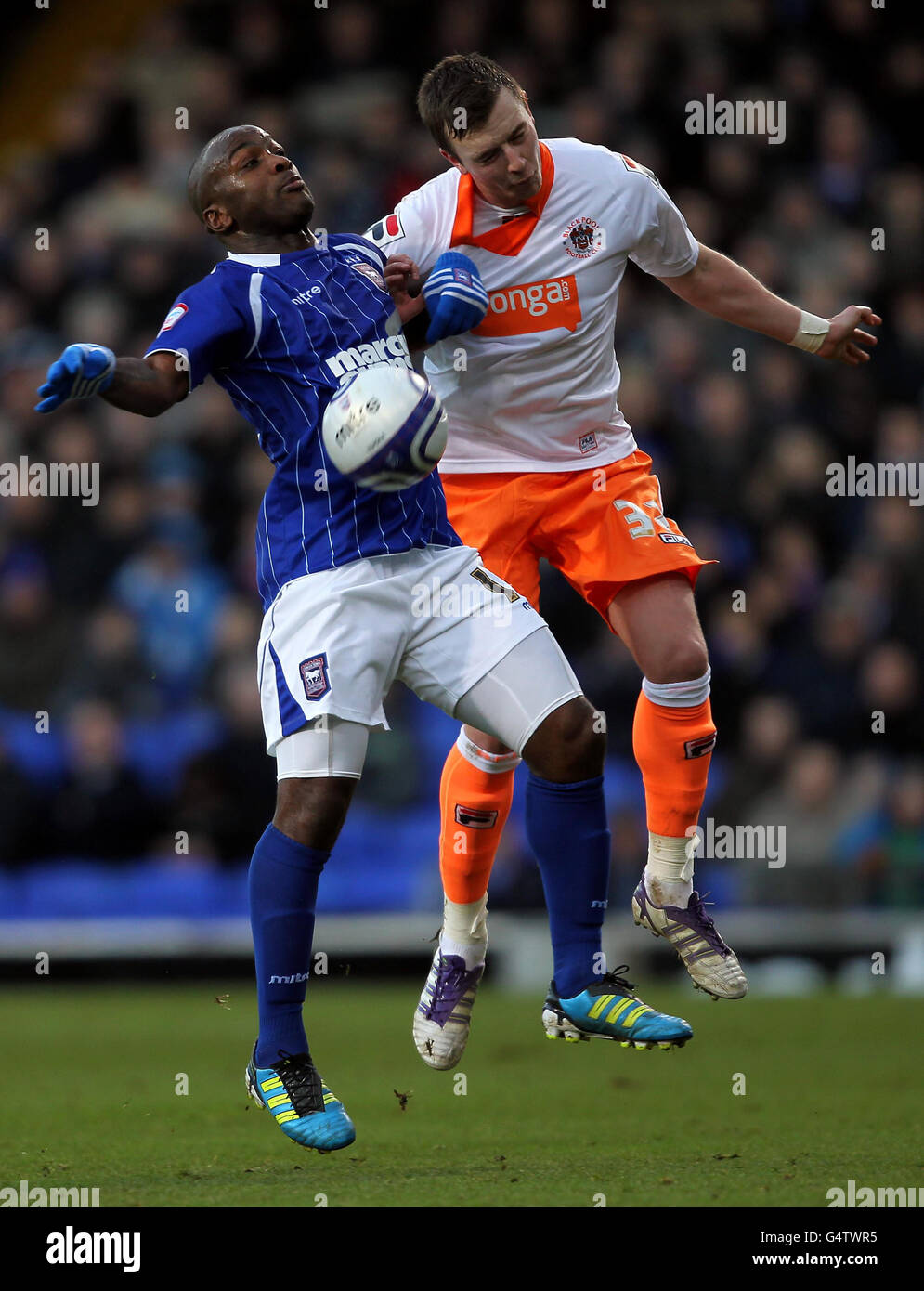 Ipswich Town's Jason Scotland and Blackpool's Danny Wilson compete for ...