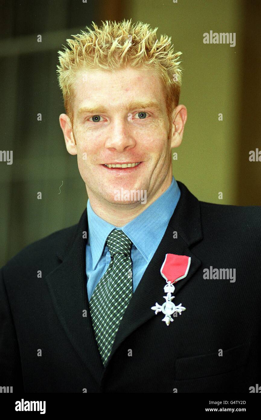 Athlete iwan thomas receiving mbe queen investiture ceremony buckingham ...