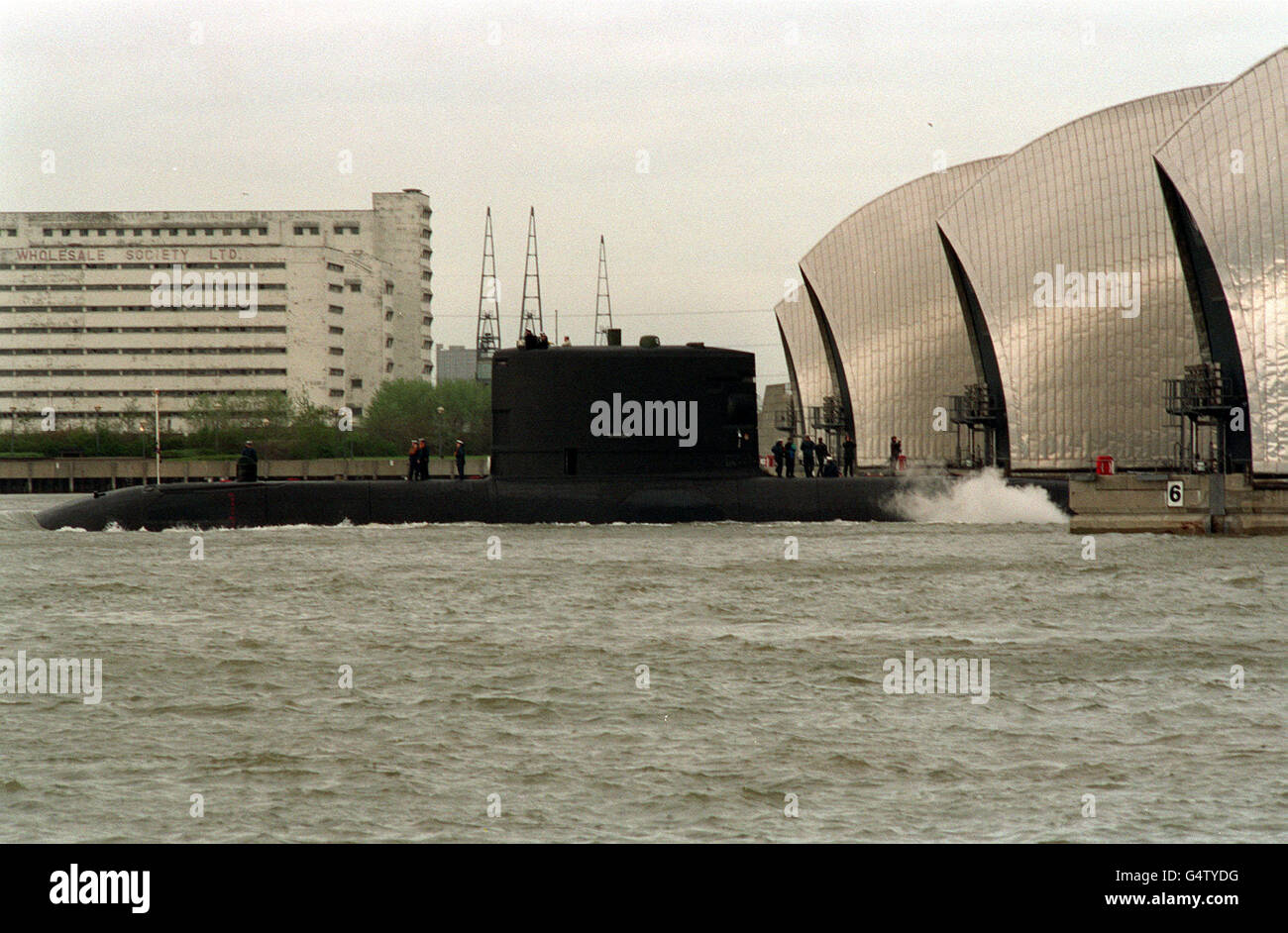 The Submarine HMS Upholder passing through the Thames Barrier during a ...