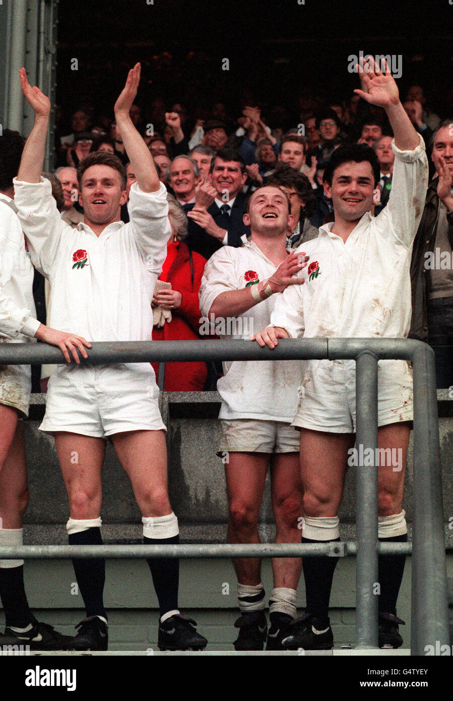 England captain Will Carling (right) celebrates with teammate Dewi ...