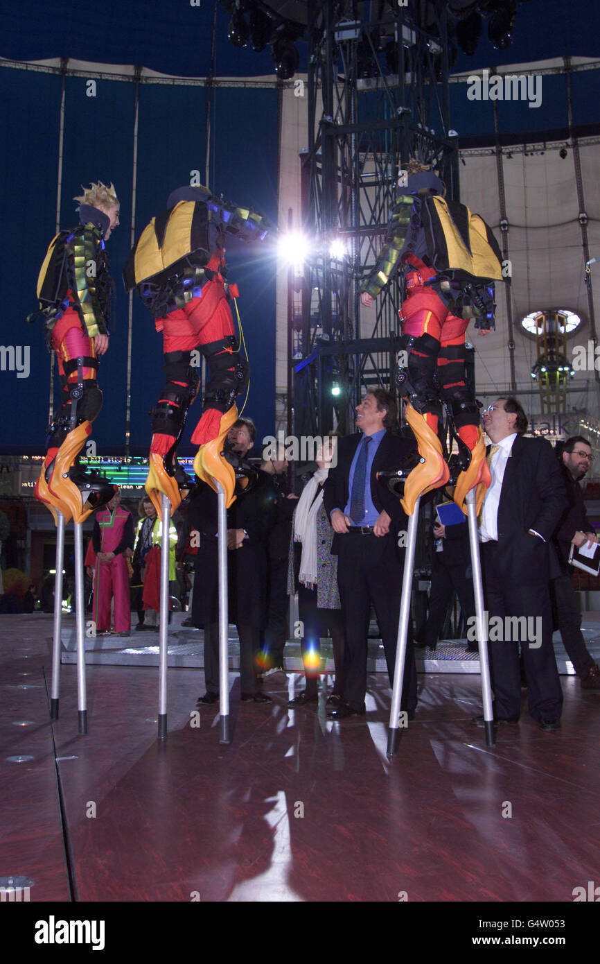 Prime Minister Tony Blair meets stilt-walking bungee jumpers while ...