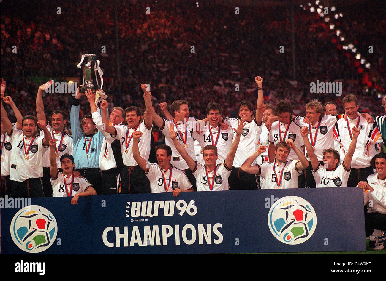 The German team celebrate with the Euro 96 trophy after their victory ...