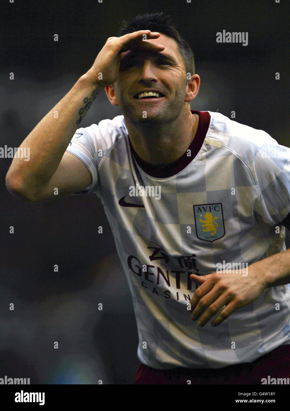 Aston Villa's Robbie Keane looks up to the press box before the game ...