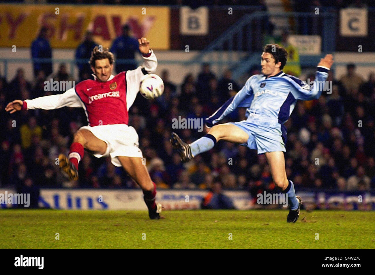 Coventry City's Robbie Keane (L) puts his side's third goal past ...