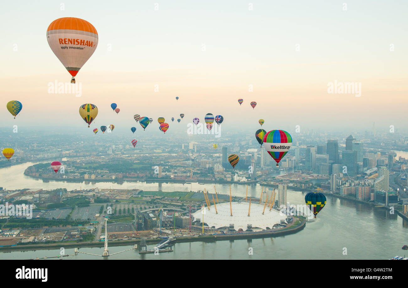 Hot air balloons fly over the O2 Arena and Canary Wharf in London ...