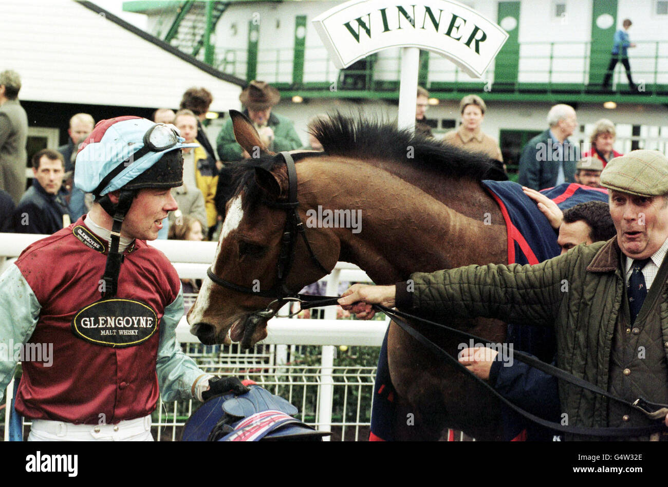 Sad Mad Bad and jockey Alan Dempsey (left) are led into the winners ...