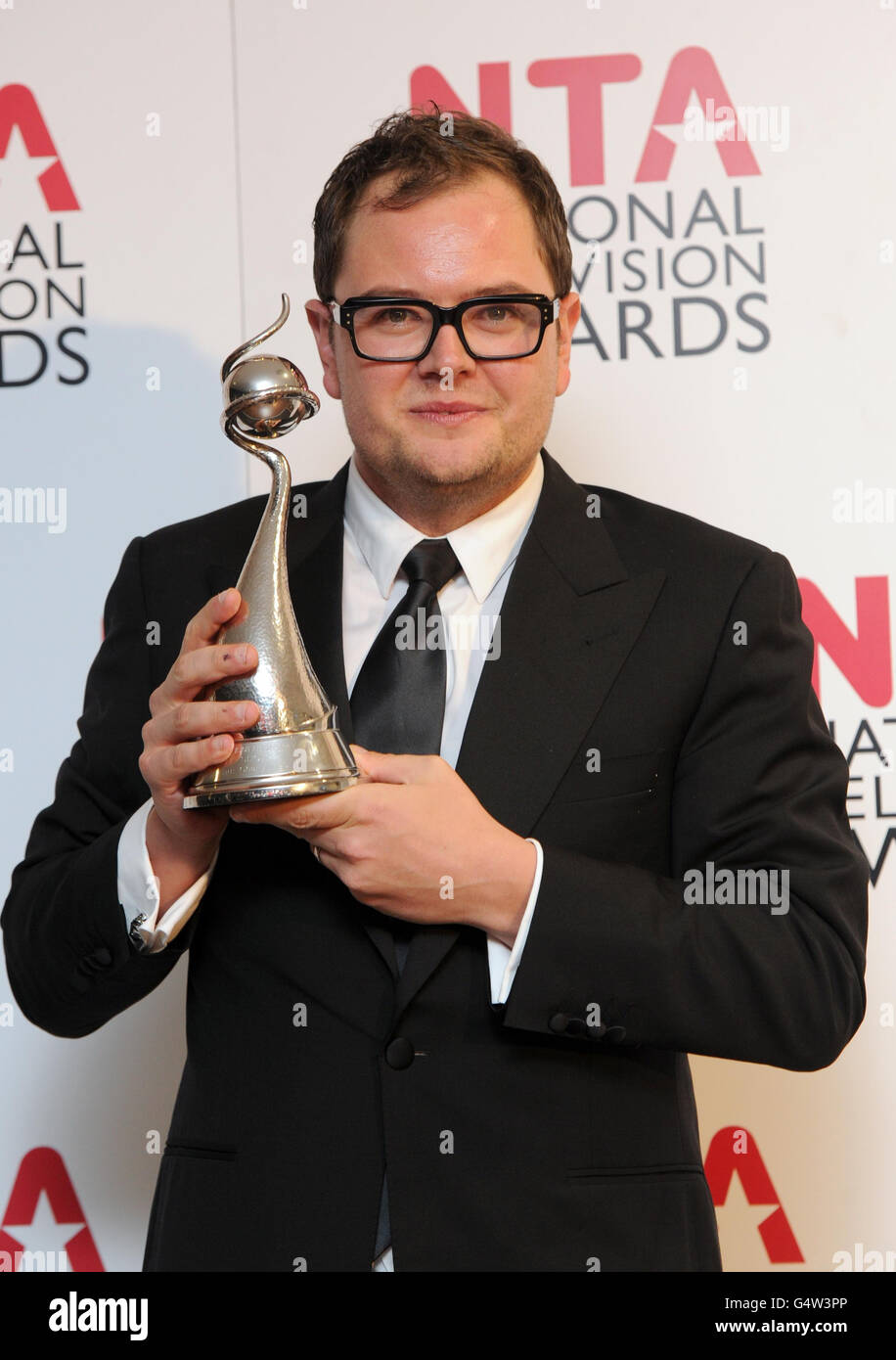 Alan Carr winner of the Talk Show award for Chatty Man, holds his award ...