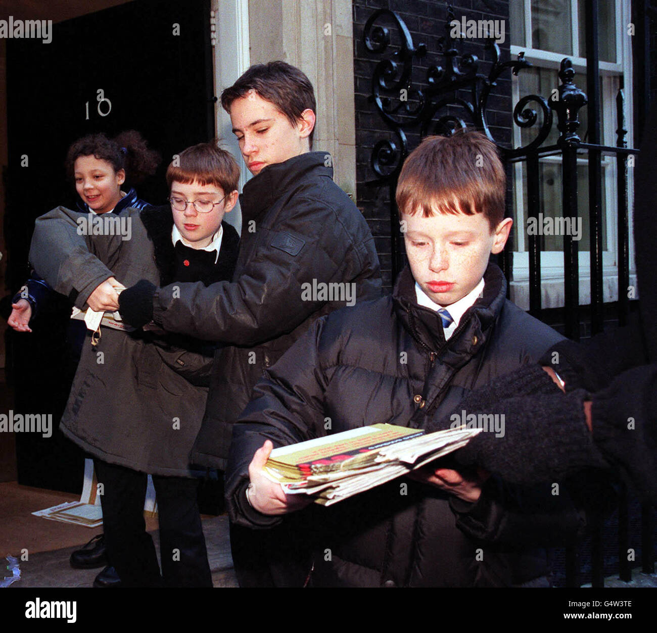 Aisha Kent, Louise Rebecca, Tom Jennings (L-R) hand in a petition to ...