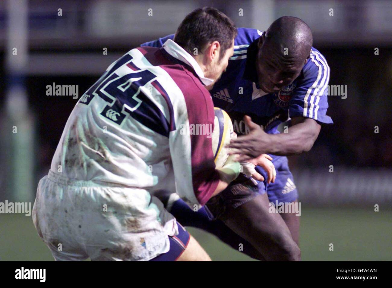 Swansea winger Richard Rees (left) runs into Bath's Adedayo Adebayo ...