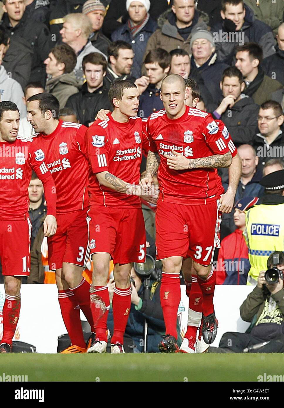 Liverpool's Daniel Agger (left) celebrates with team mate Martin Skrtel ...