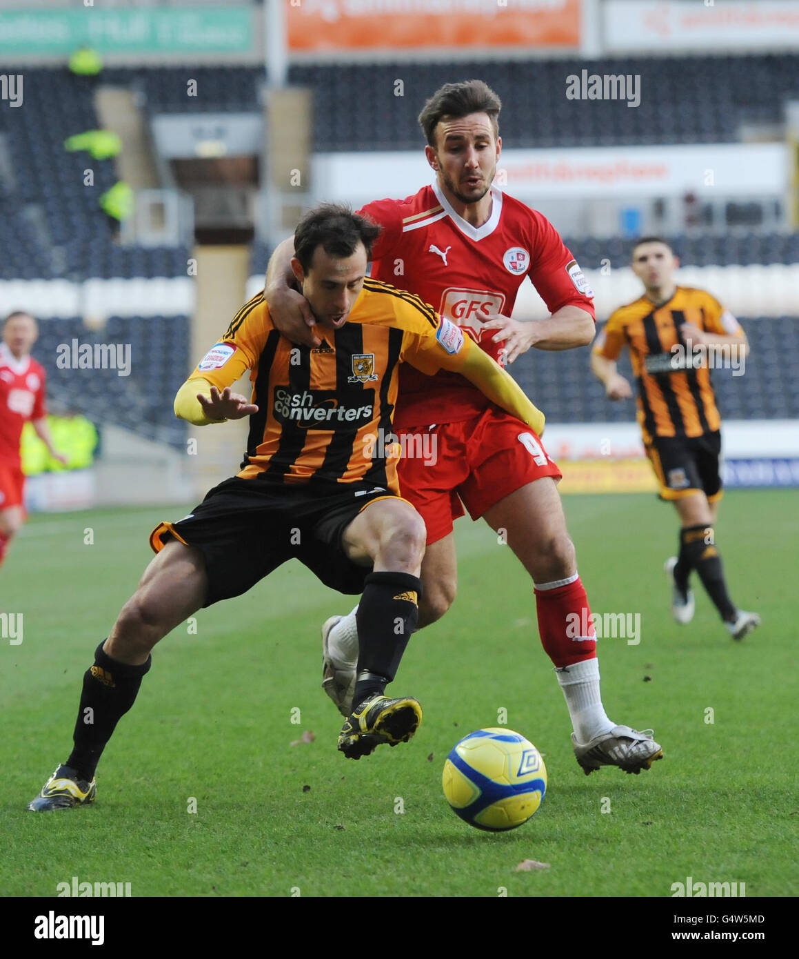 Hull City's Richard Garcia (left) and Crawley Town's Matt Tubbs battle ...