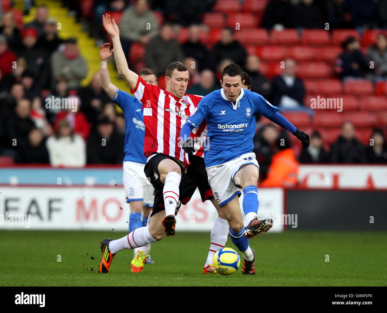 Sheffield United's Kevin McDonald goes in to challenge Birmingham City ...