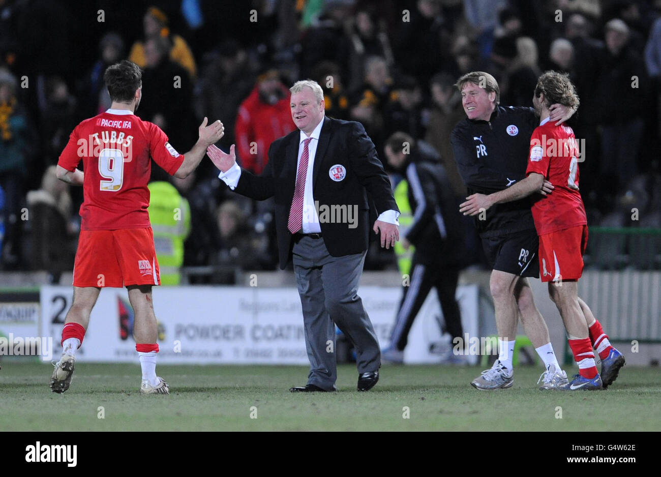 Crawley Town manager Steve Evans (centre) congratulates goal scorer ...