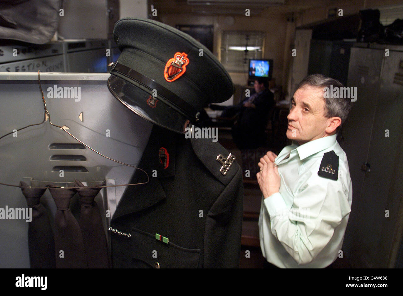 An Royal Ulster Constabulary officer gets ready for another day of duty ...
