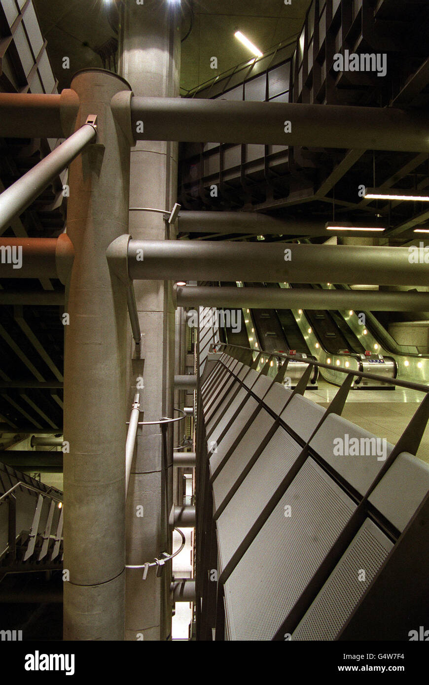 Detail of pipes pillar next to set of escalators staircase hi-res stock ...