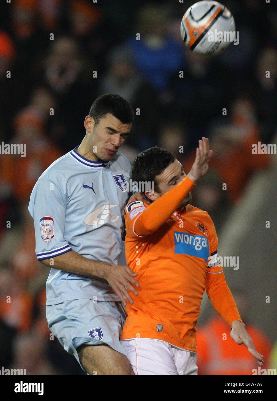 Coventry City's Conor Thomas outjumps Blackpool's Barry Ferguson during ...