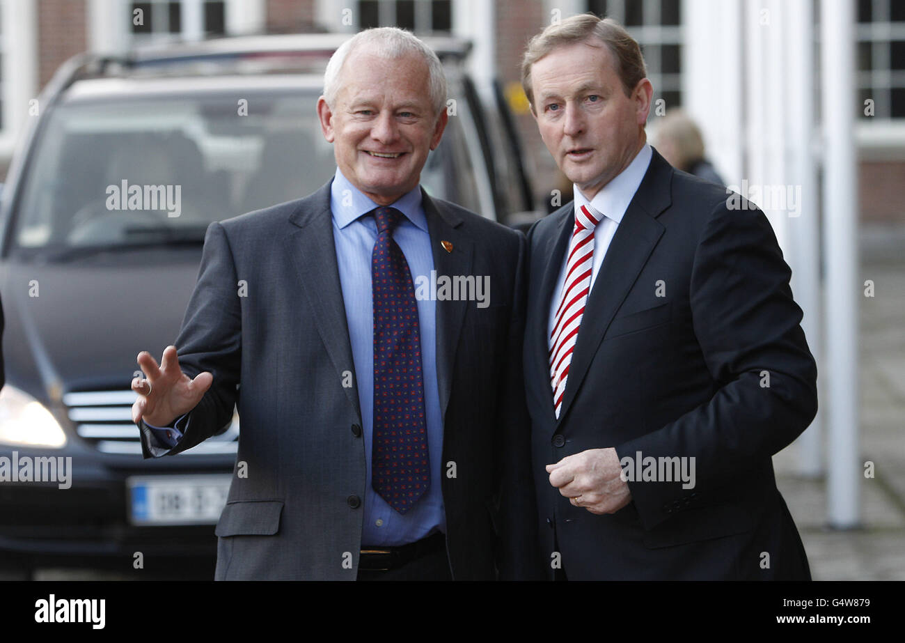 Chief Minister of the Isle of Man Allan Bell (left) is greeted by ...