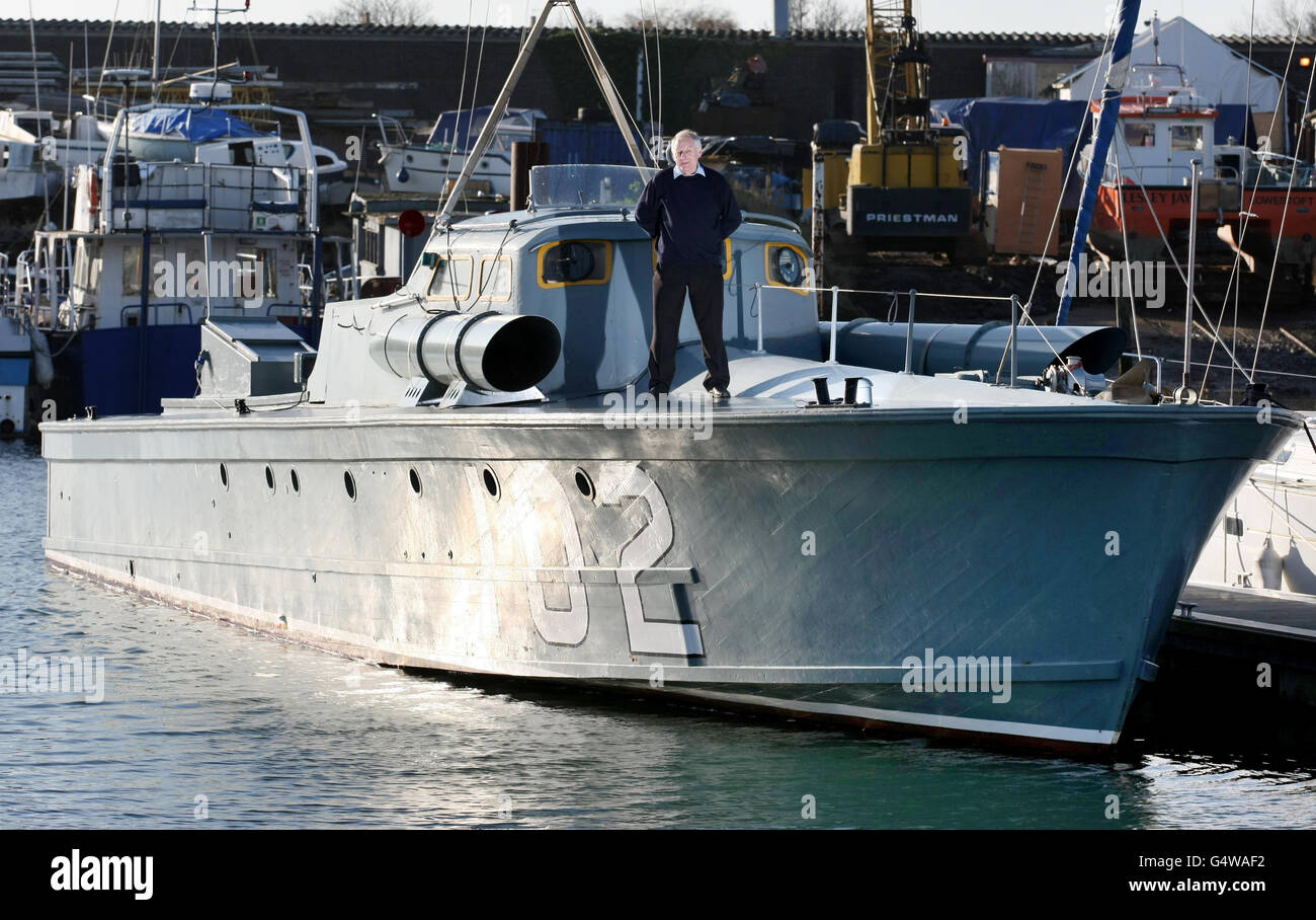 Richard Basey stands on the deck of Motor Torpedo Boat 102, tied up at ...